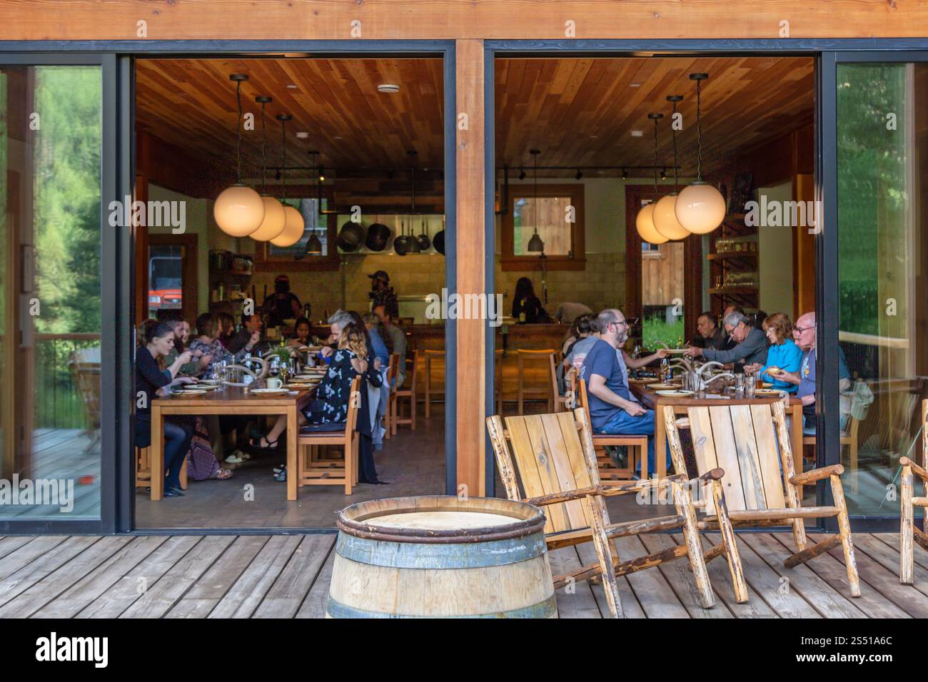 Group of People Dining Together in a Rustic Indoor Setting, Eagle Cap ...