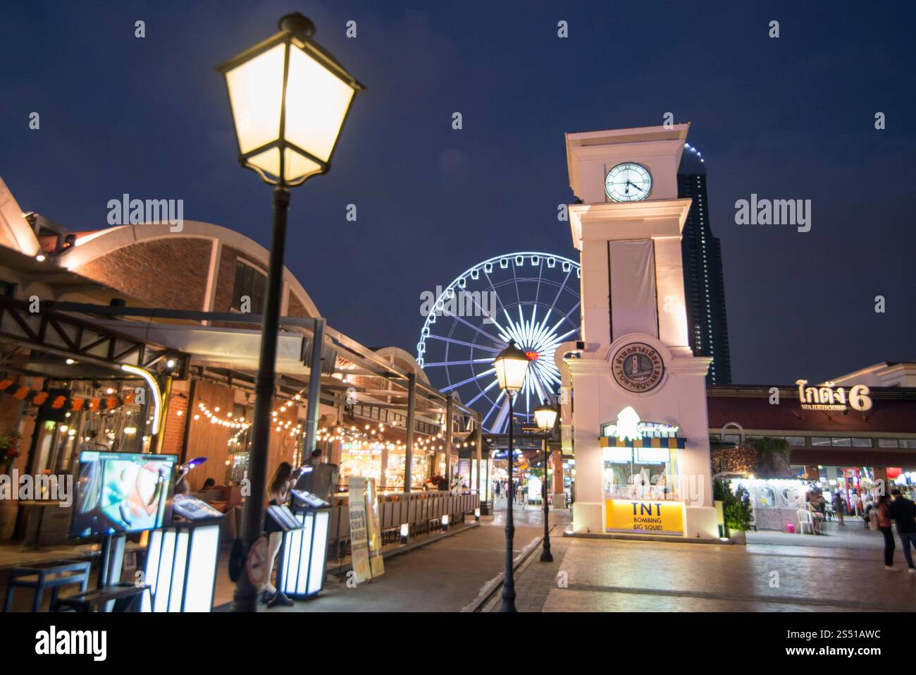 the clock tower and the Ferris Wheel of the Asiatique Riverfront ...