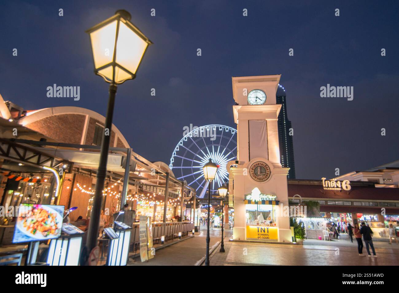 the clock tower and the Ferris Wheel of the Asiatique Riverfront ...