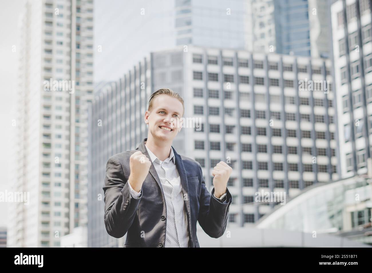 Happy successful businessman celebrating hi-res stock photography and ...