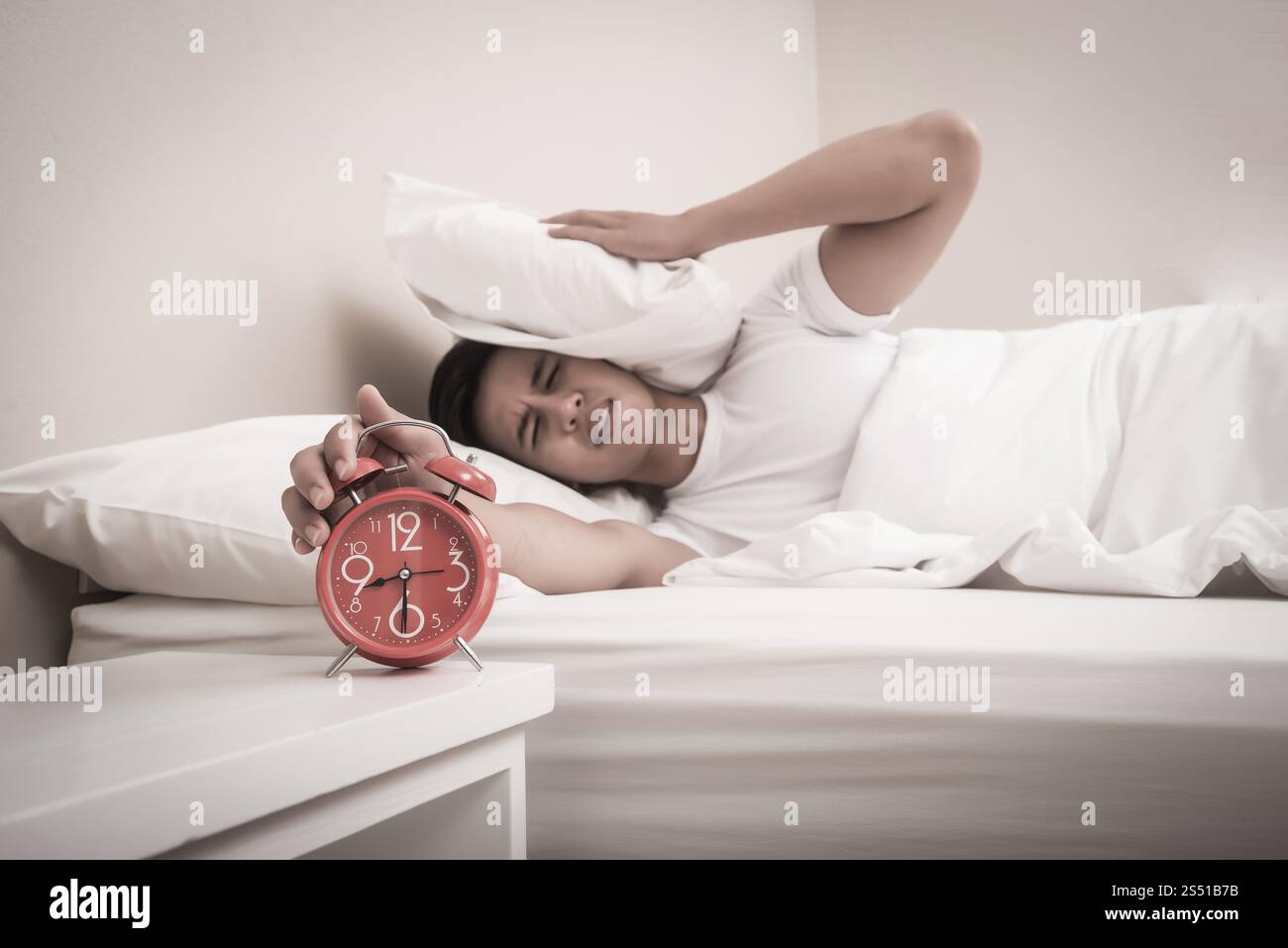 Man hand turns off the alarm clock waking up at morning . . Man hand ...