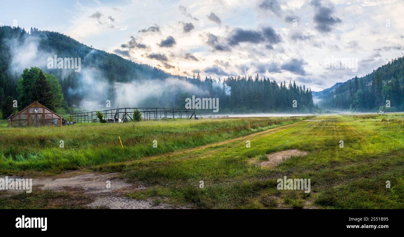 Idyllic Countryside Scene with Misty Fields and Wooden House in Nature ...