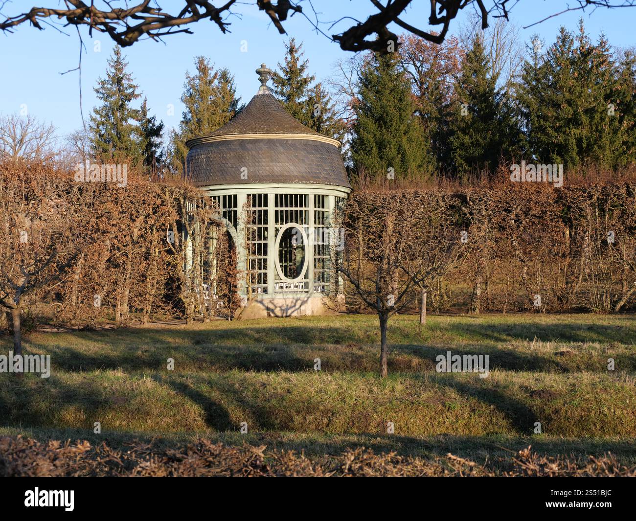 Romantic round lime green garden pavilion in a baroque park in the ...