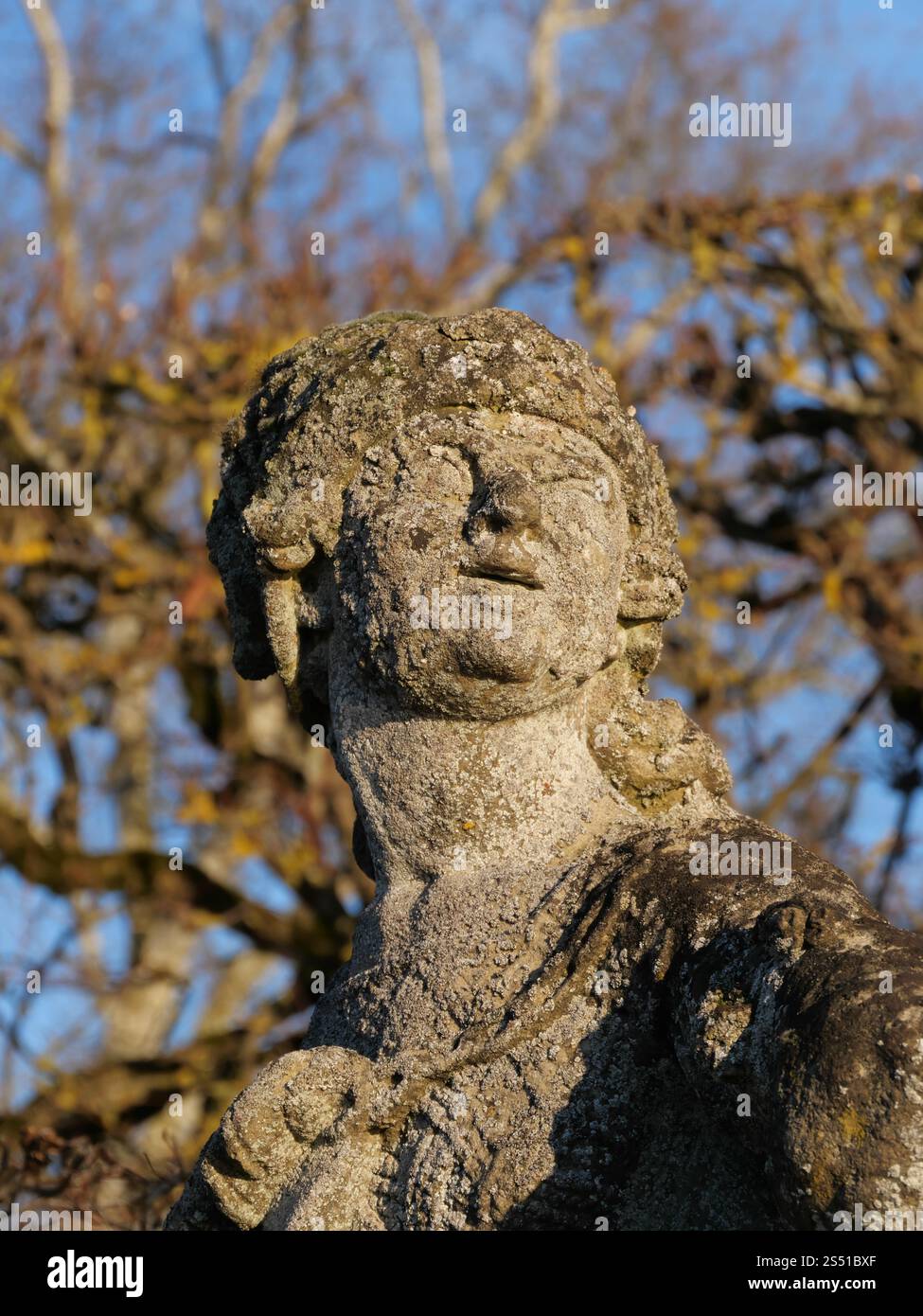 Head of a baroque sandstone statue of a woman with a scroll in her hand ...