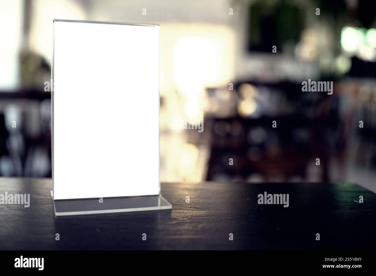 Menu frame standing on wood table in Bar restaurant cafe. space for ...