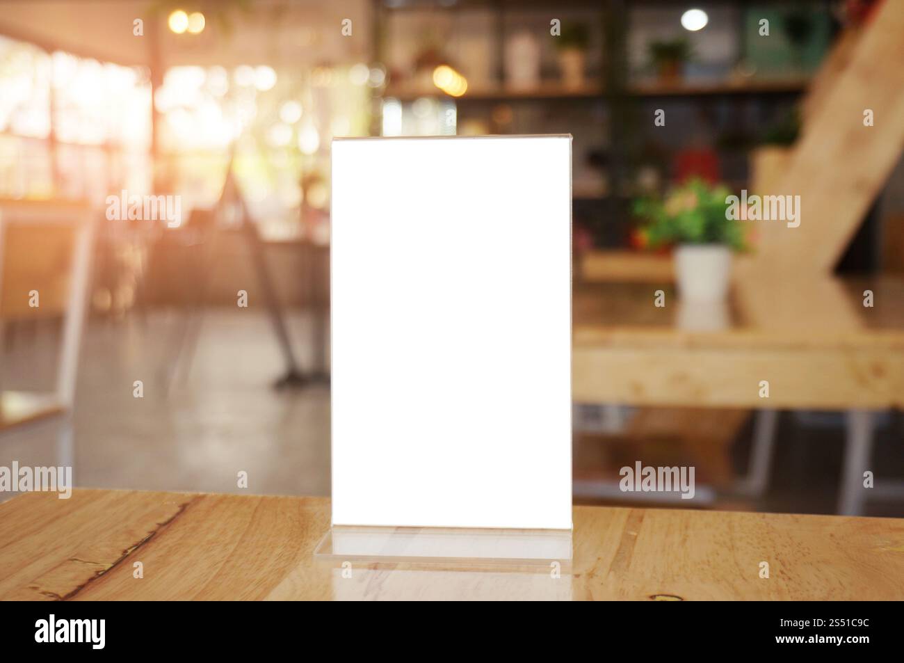 Mock up Menu frame standing on wood table in Bar restaurant cafe. space ...
