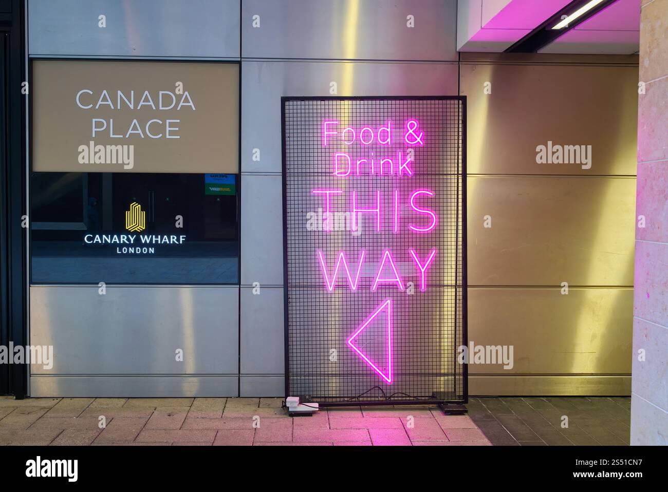 Food and drink this way neon sign outside Canada Place in Canary Wharf ...