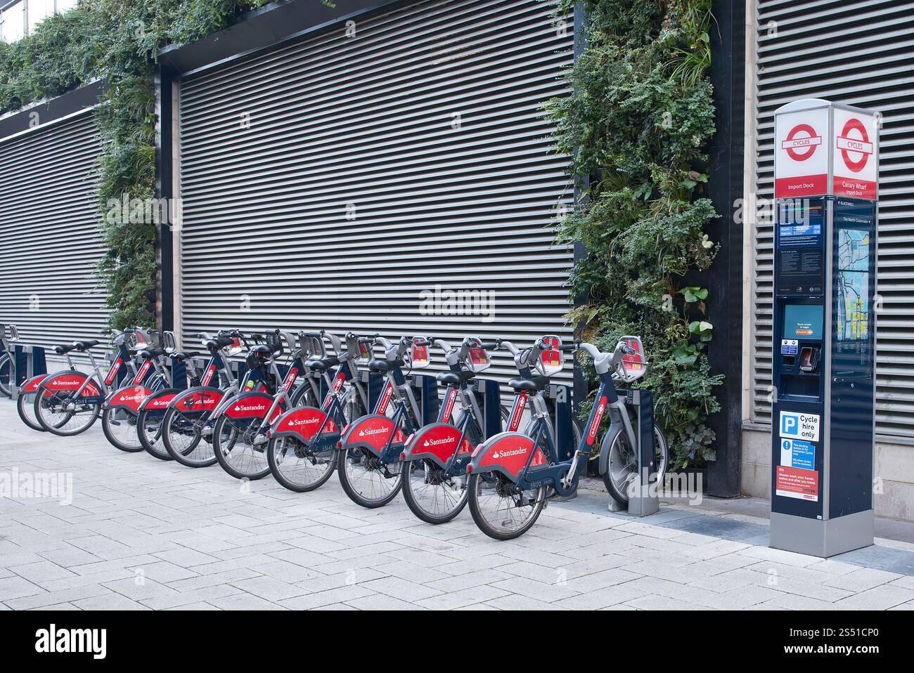Santander hire bikes docked at a station in Canary Wharf. London - 12th ...