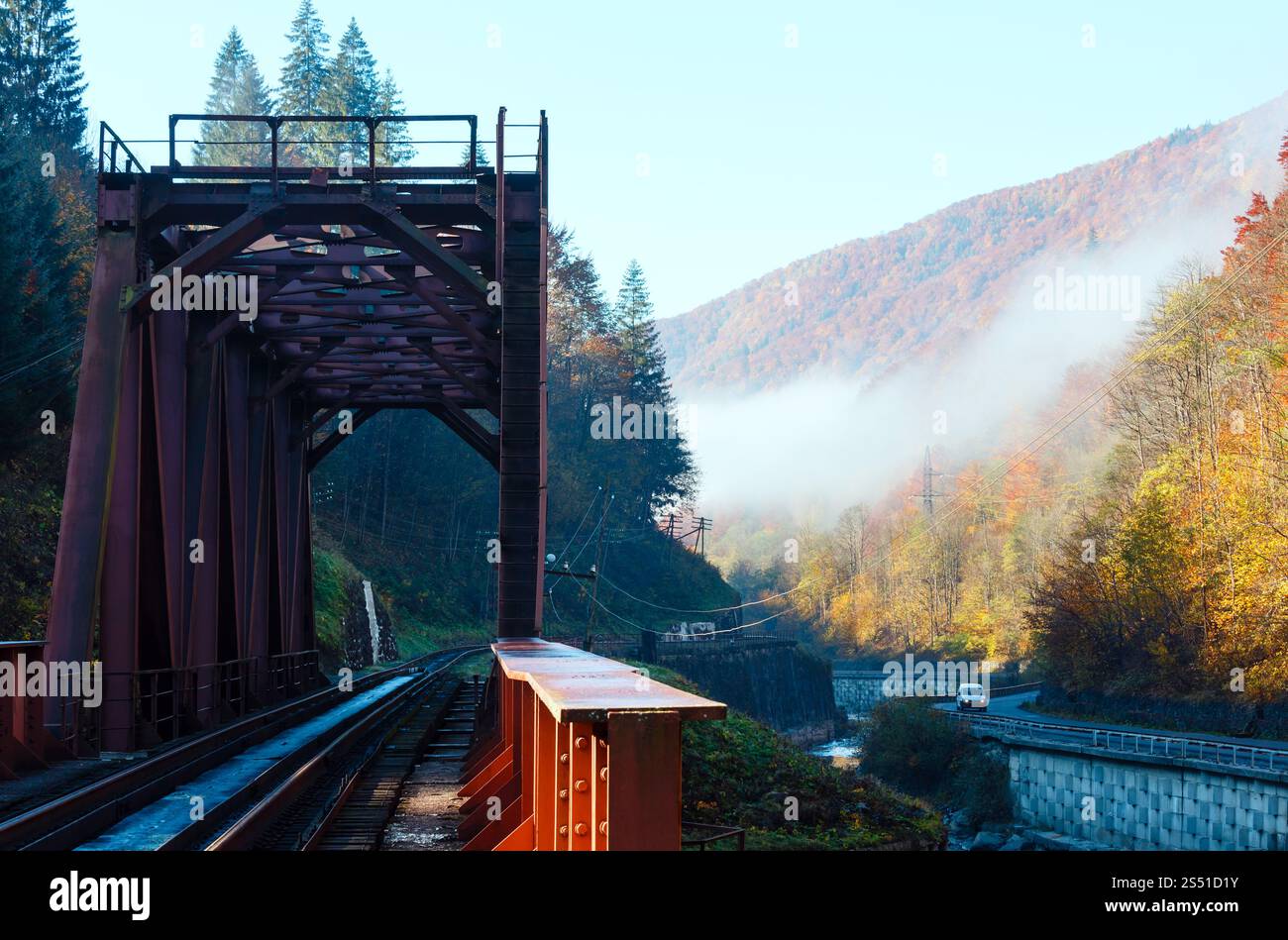 Autumn Carpathian Mountains misty landscape with railroad bridge ...