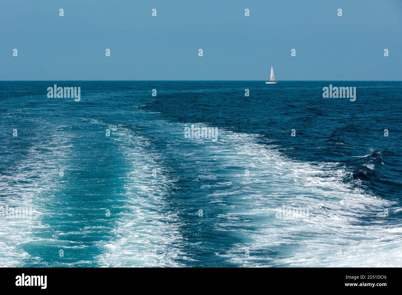 Trace tail of speed boat or ferry on water surface in the sea and white ...