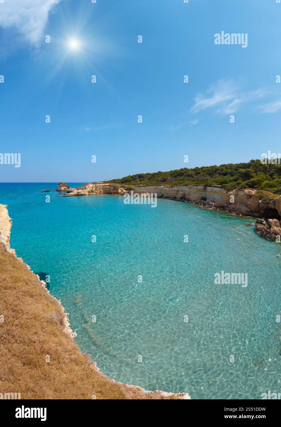 Picturesque sunshiny seascape with white rocky cliffs, sea bay, islets ...
