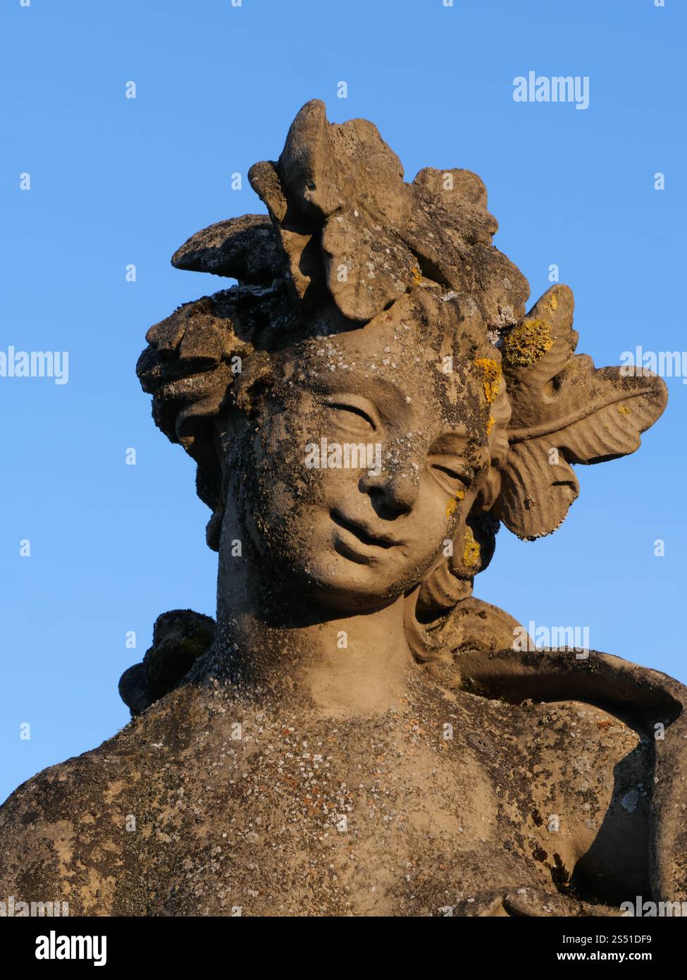 Head of a baroque sandstone statue of a woman with a scroll in her hand ...