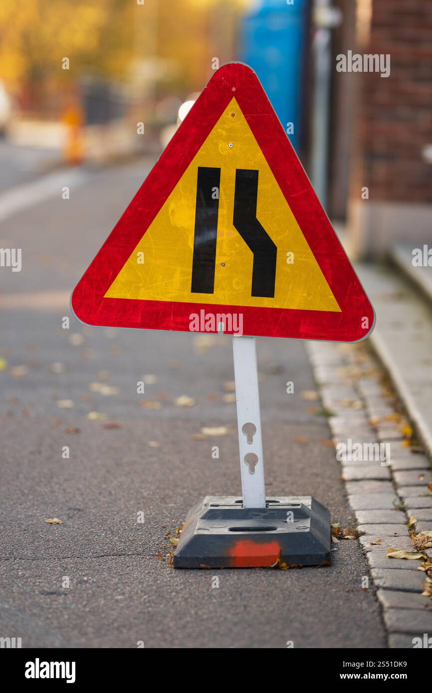 Temporary road sign warning for narrow road ahead Stock Photo - Alamy