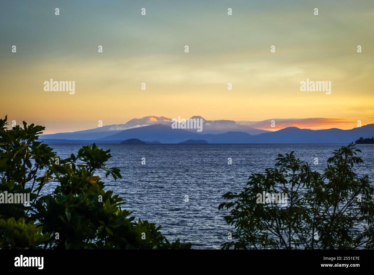 Taupo Lake and Tongariro volcano landscape at sunset, New Zealand ...