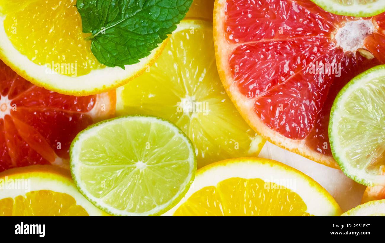 View from above on assortment of frehsly cut citrus fruits. Image from ...