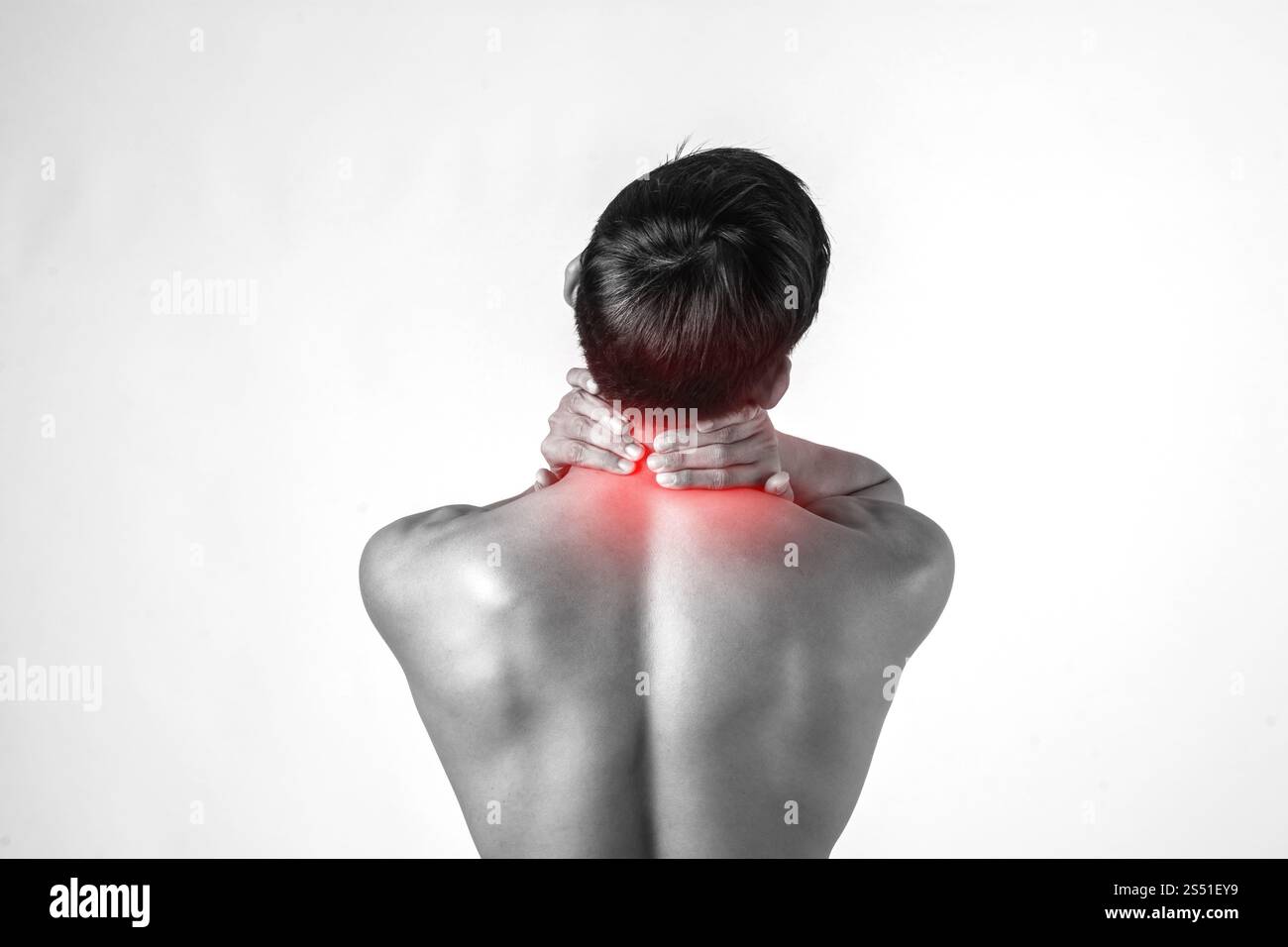 Muscular man use handles at the neck to relieve pain isolated on white ...