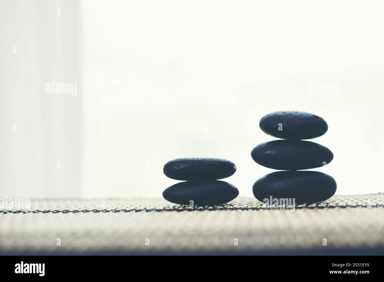 Stack of spa hot stones isolated on white background Stock Photo - Alamy