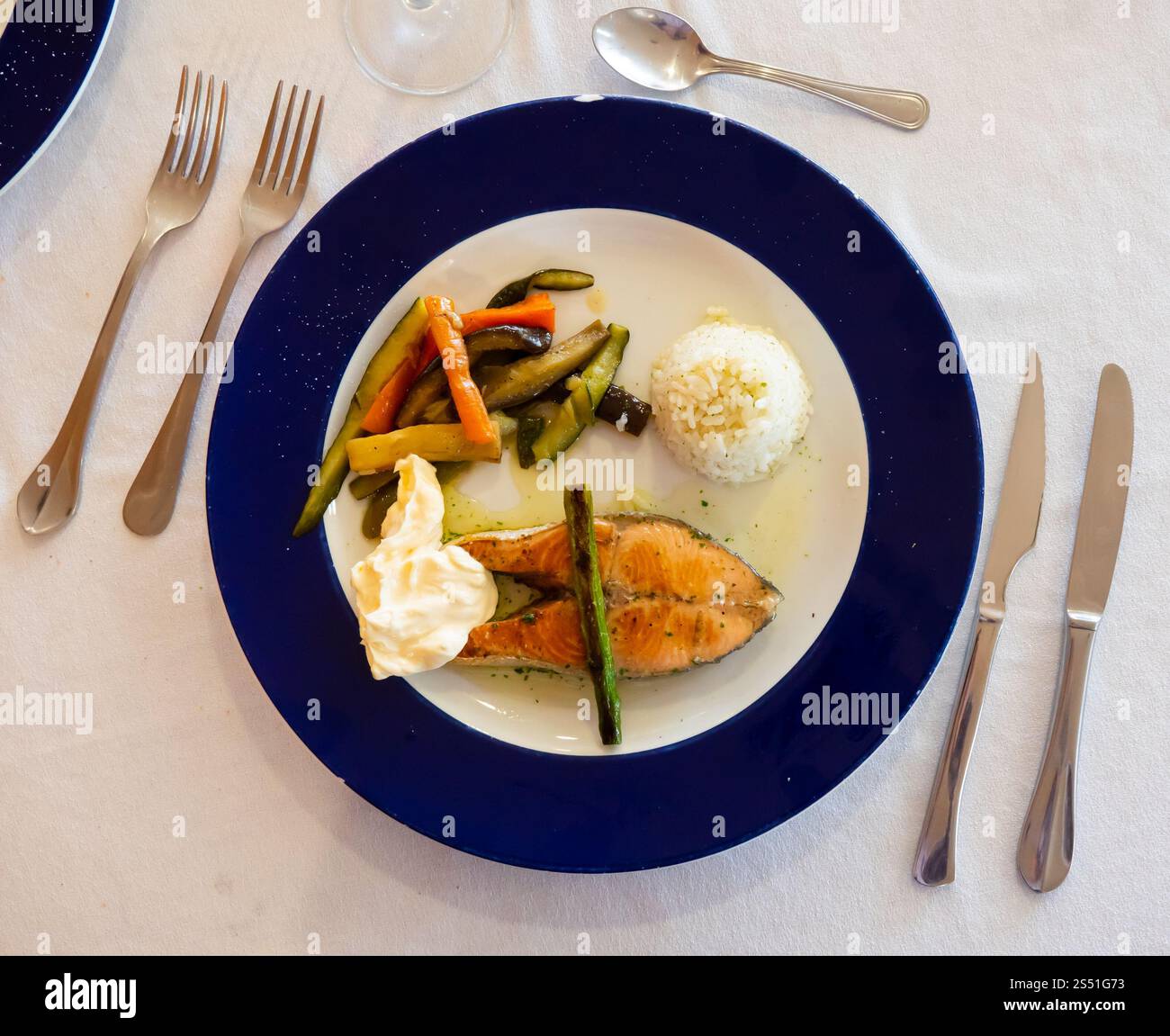 Baked salmon served with rice and vegetables Stock Photo - Alamy