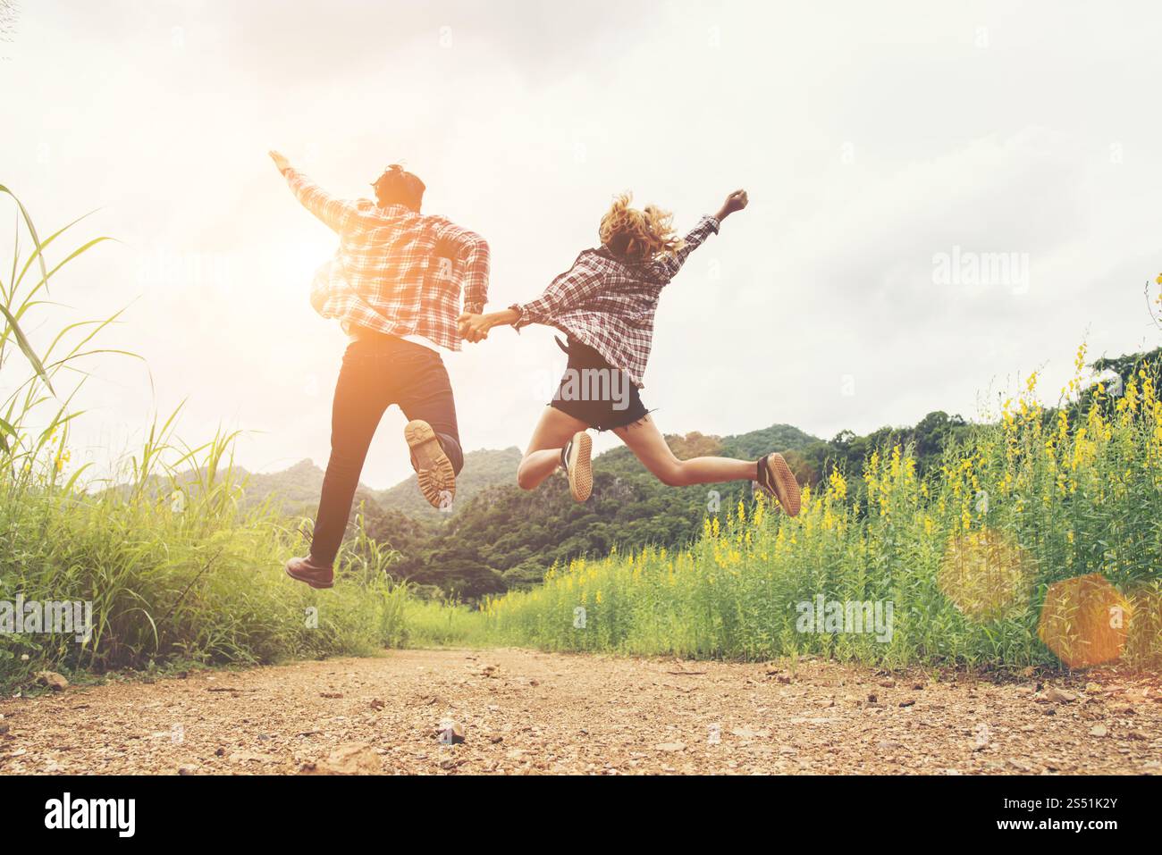 Group smiling teenagers jumping hi-res stock photography and images - Alamy