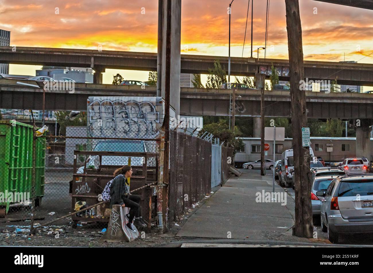 Urban Street at Sunset Featuring Overpass and Sidewalk Activity ...