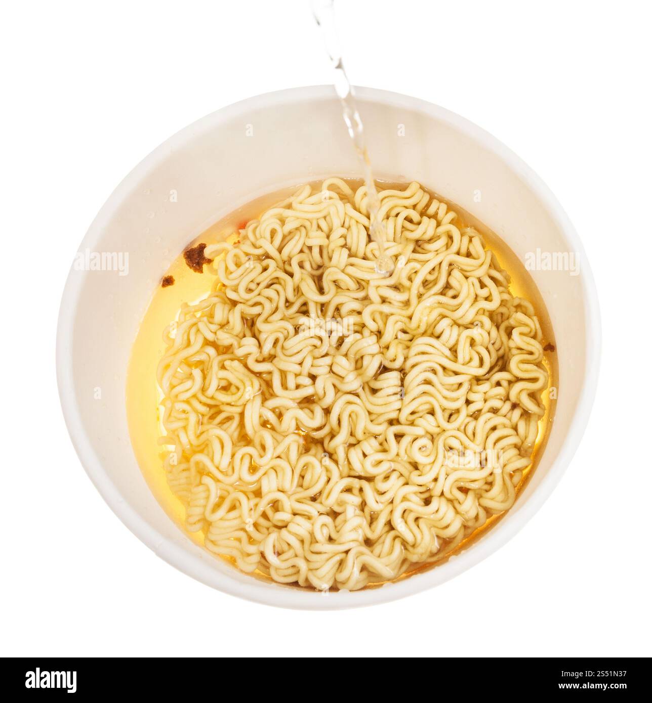 cooking instant noodles - pouring hot water into cup with instant ...
