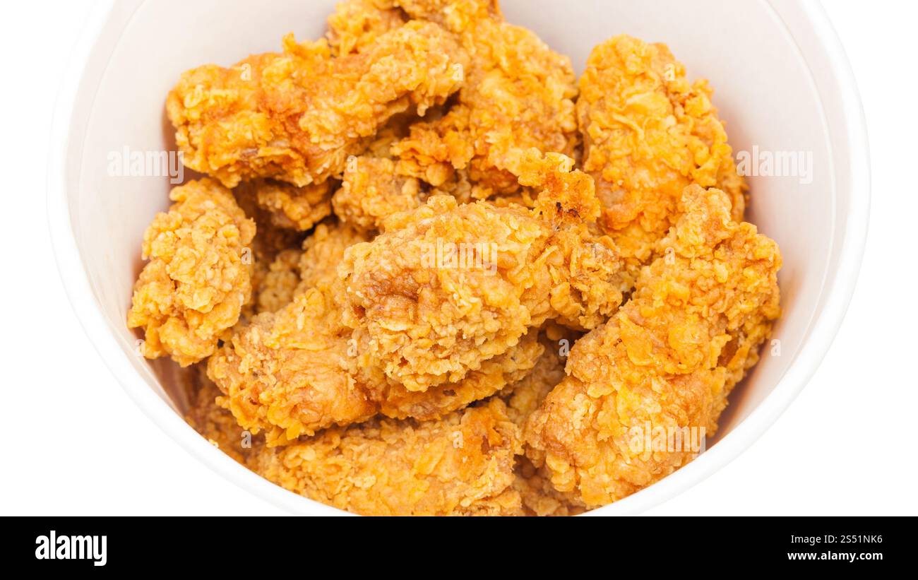 many crispy batter deep-fried chicken wings in paper bucket isolated on ...