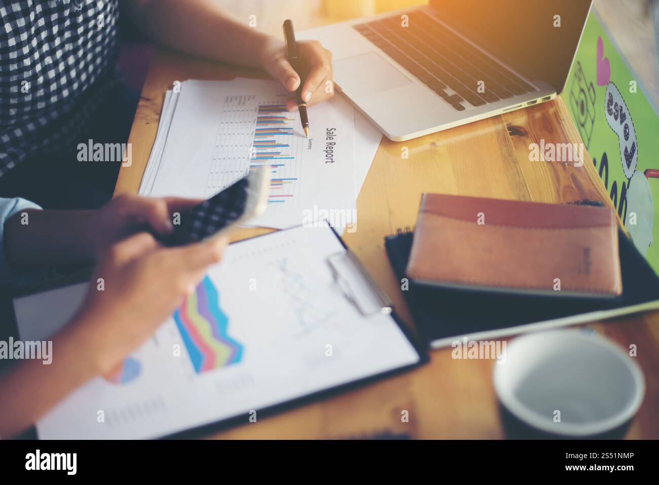 Business team meeting analysis financial chart together at cafe Stock ...