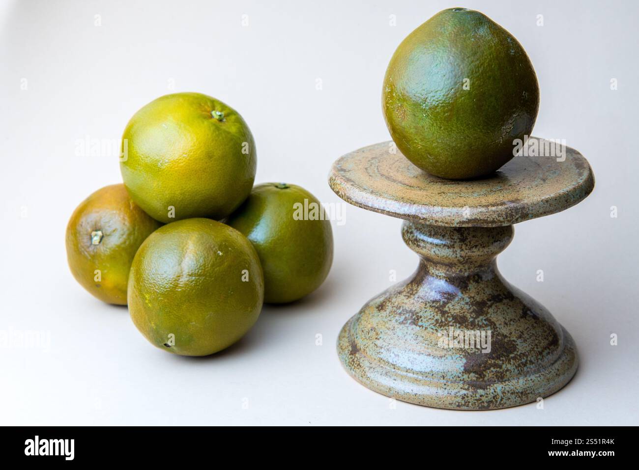 Navel Chocolate Oranges on the cake stand. White background. Chocolate ...