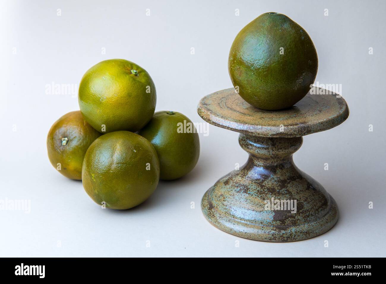 Navel Chocolate Oranges on the cake stand. White background. Chocolate ...