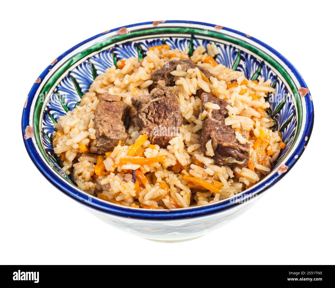 above view of prepared plov (central asian dish from rice with meat and ...