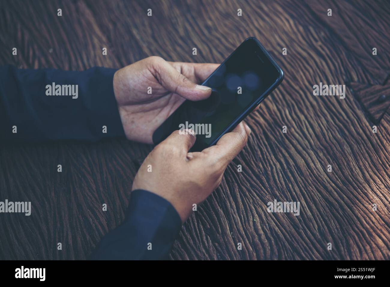 hand holding smart phone and play something Stock Photo - Alamy