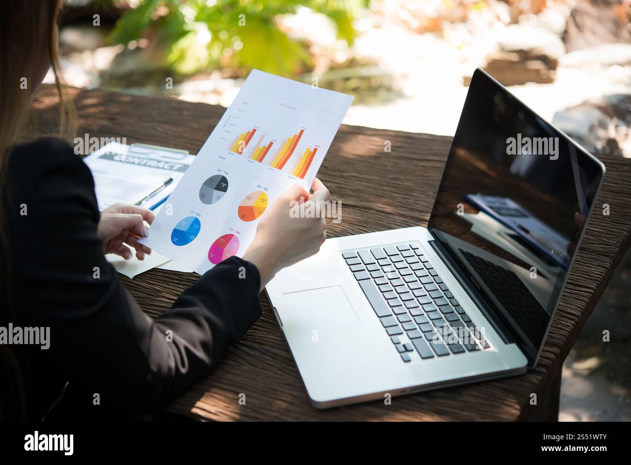 business woman working with documents graphs ,analyzing investm ...