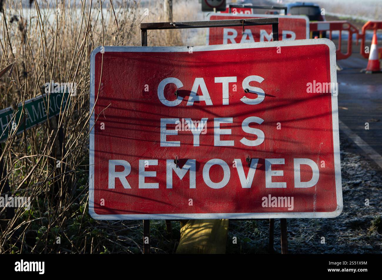 cats eyes removed road sign, Cambridgeshire Stock Photo - Alamy
