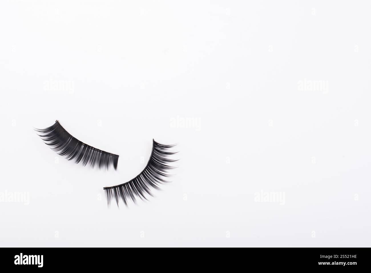 Black false eyelashes isolated on white background Stock Photo - Alamy