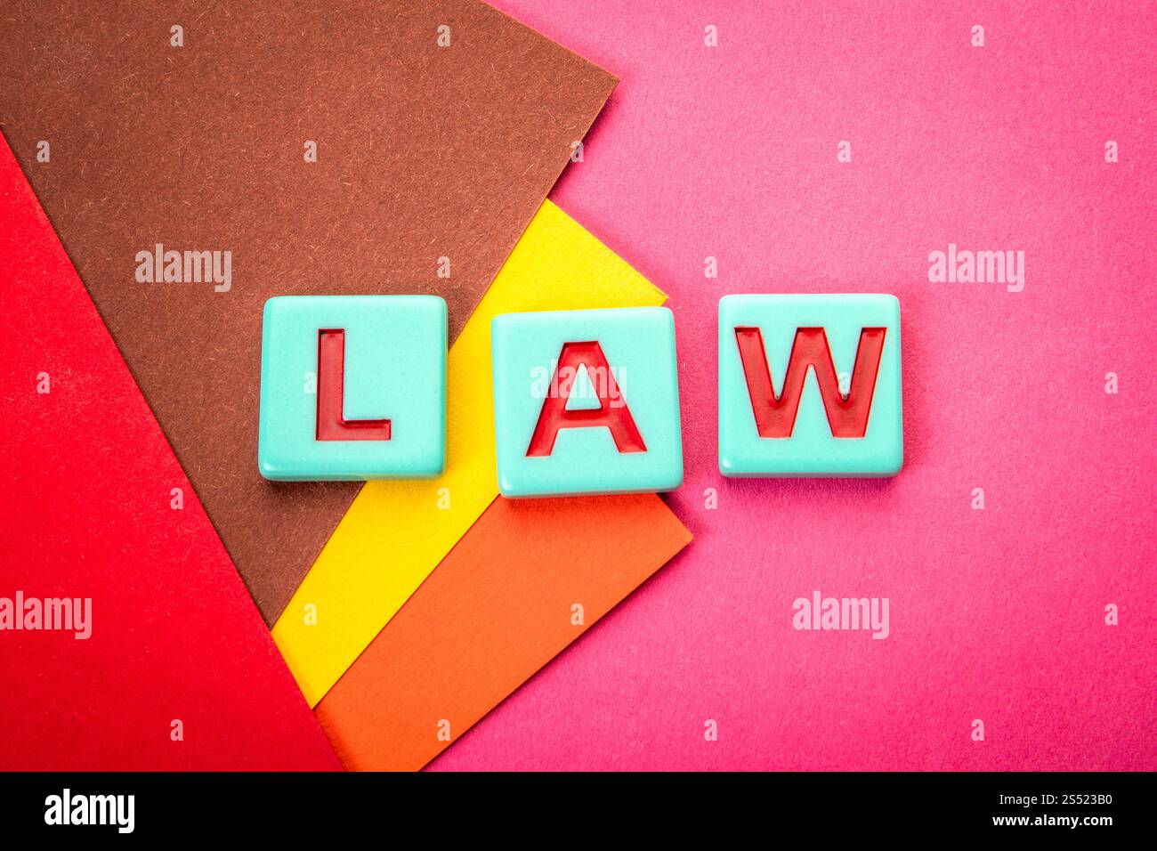 LAW. Alphabet letter tiles on a red textured background Stock Photo - Alamy