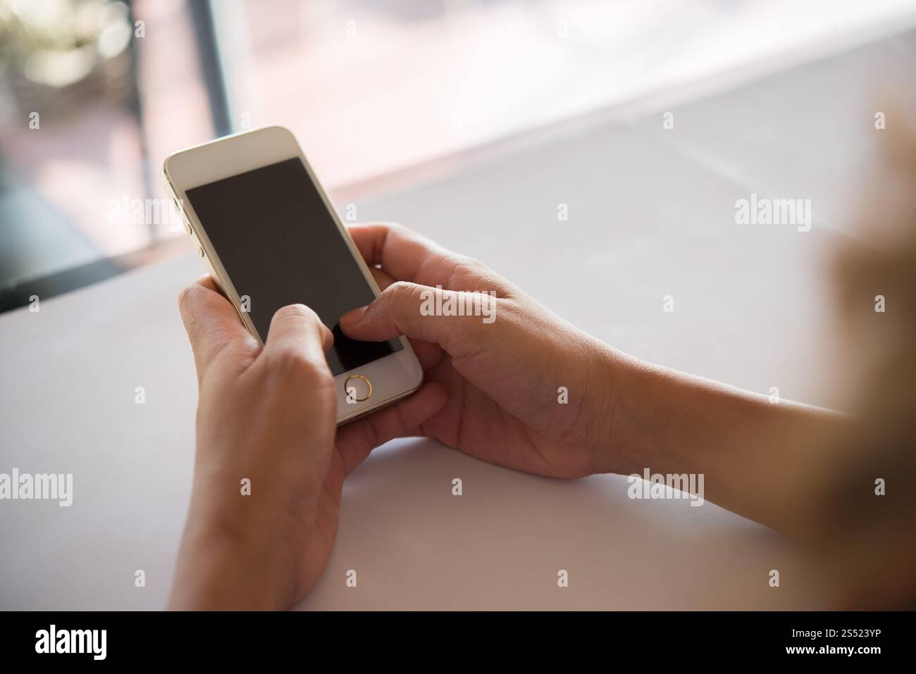 Close up of Womans hands holding cell phone with blank copy spa. Close ...