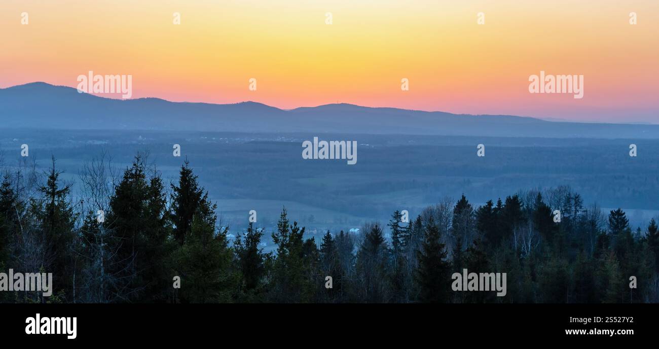 Spring evening sunset pre mountain countryside view with forests ...