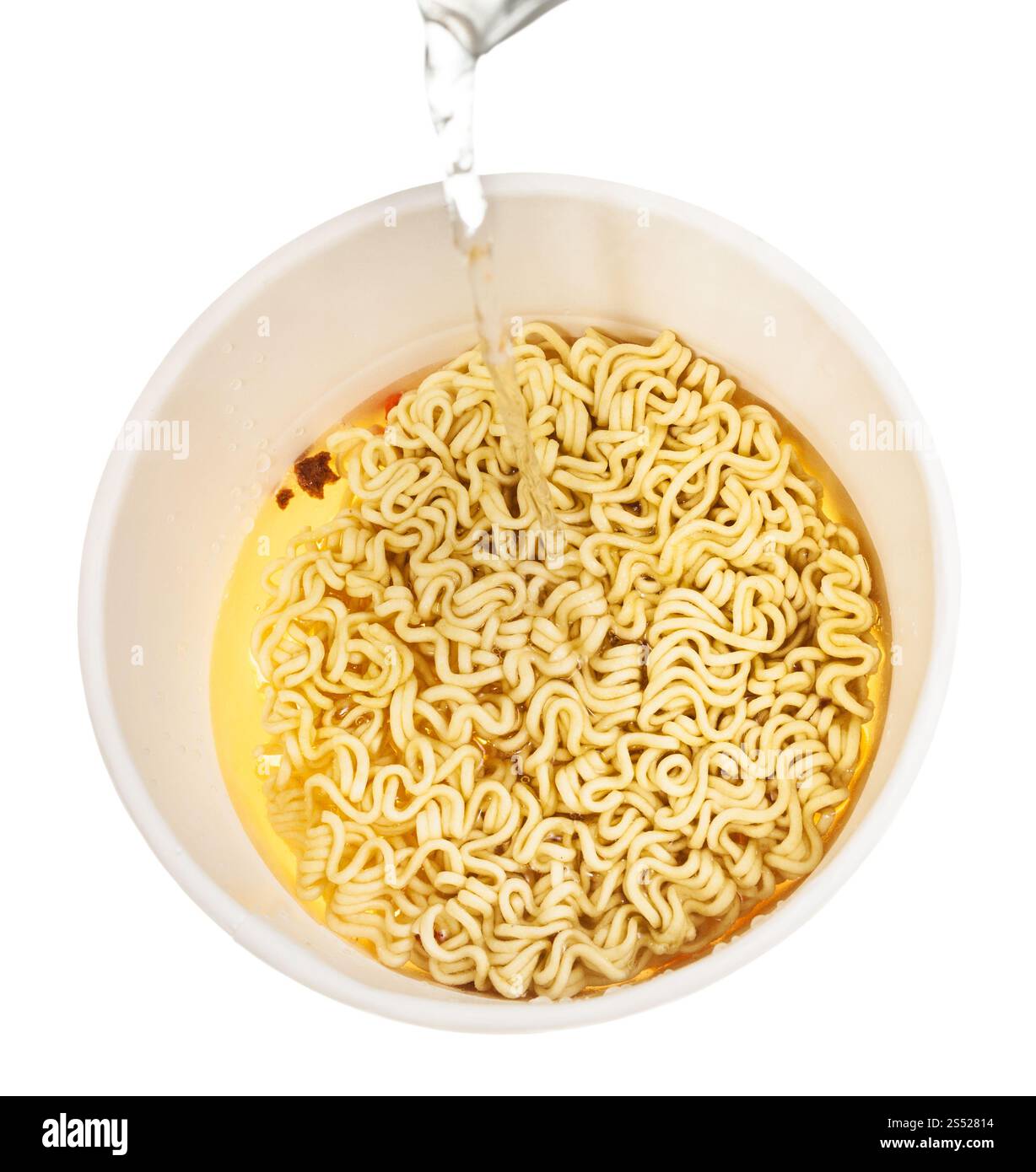 cooking instant noodles - water trickle flows in cup with dried instant ...