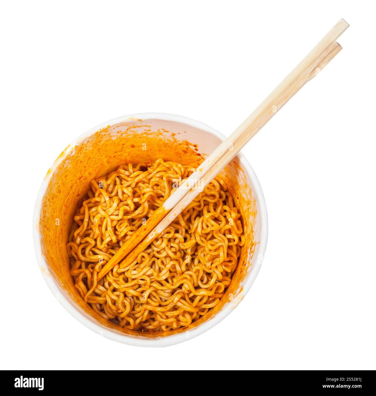 top view of chopsticks in cup with spicy instant noodles isolated on ...