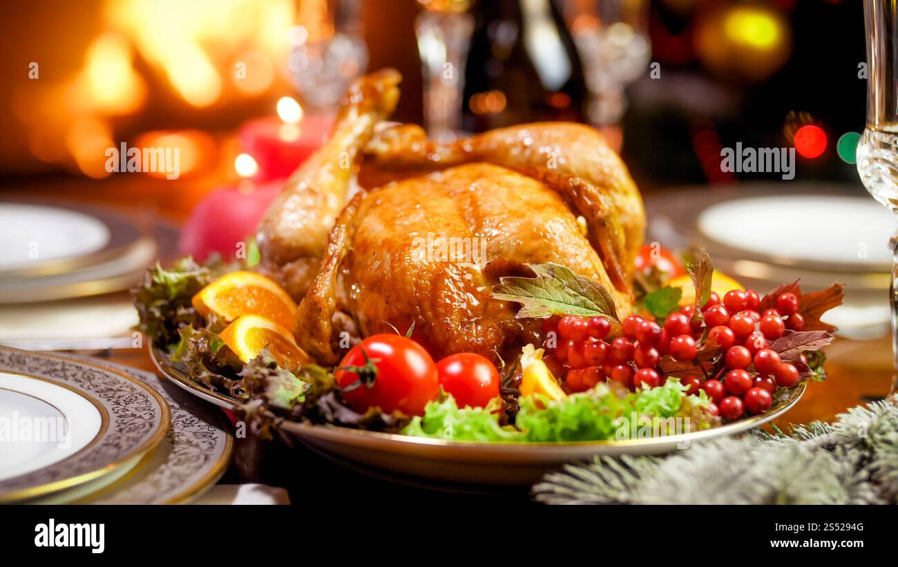 Closeup photo of chicken baked with vegetable on family Christmas ...