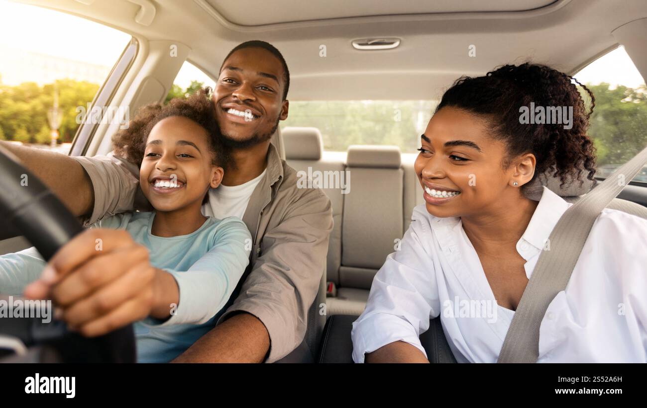 African Father Teaching Daughter To Drive Driving Car Together Outdoor ...