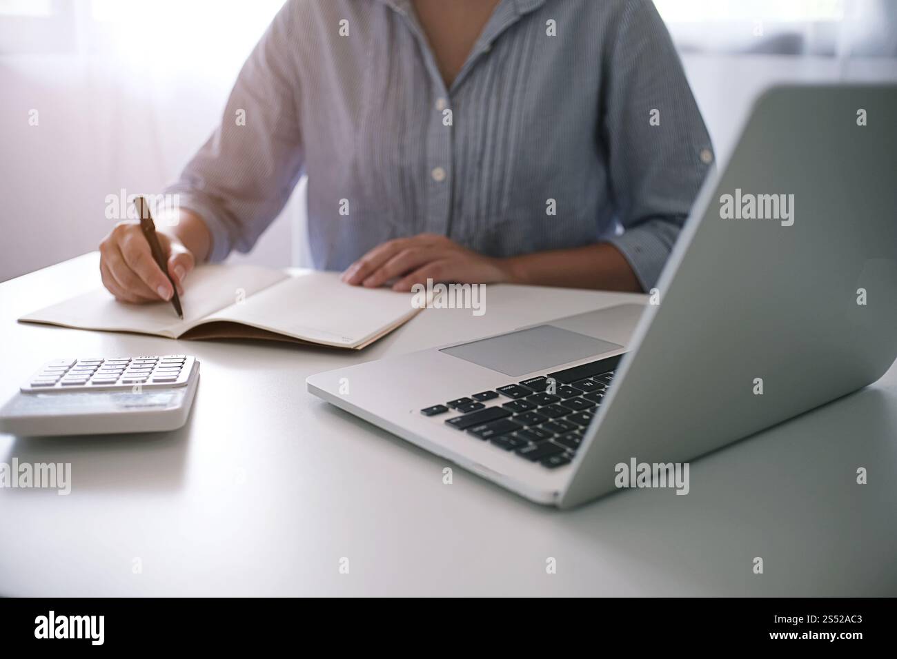Business accounting women work with calculator and Laptop. Financial ...
