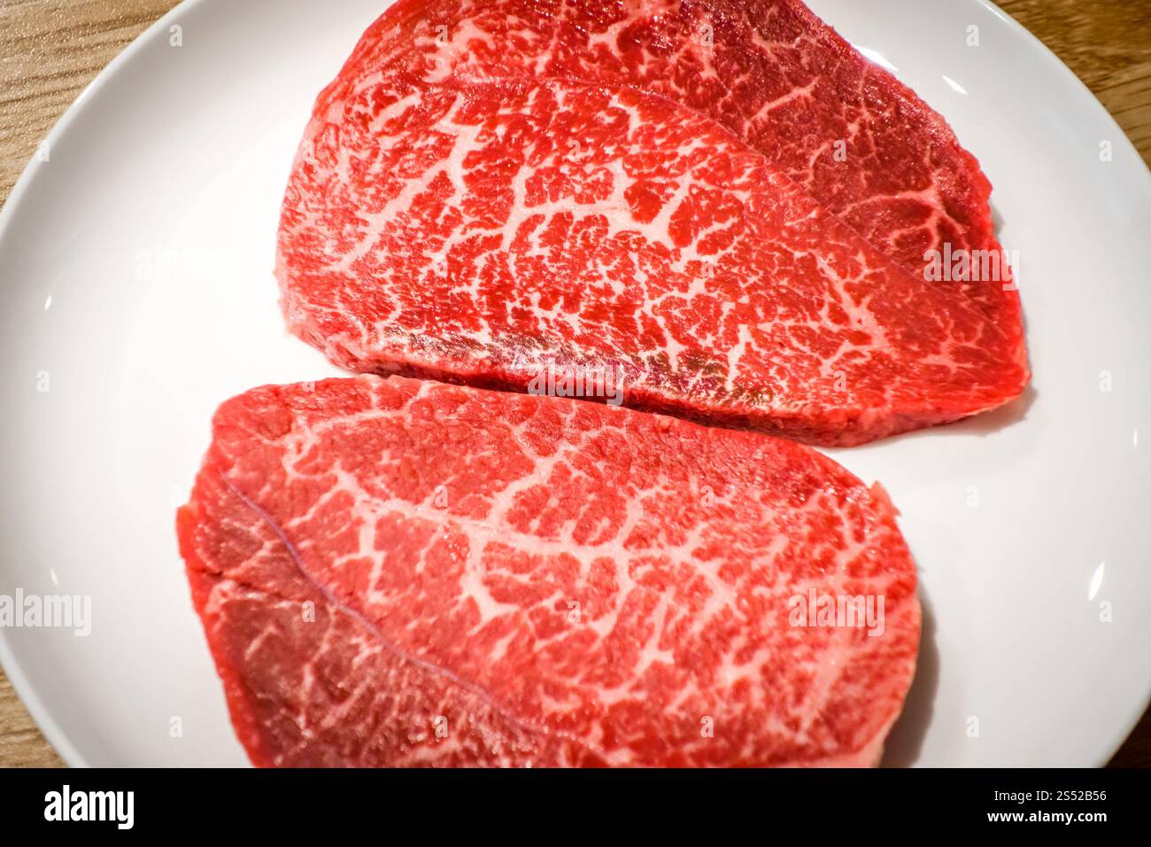 Raw Kobe wagyu beef steaks in a plate. Kobe wagyu beef steak Stock ...
