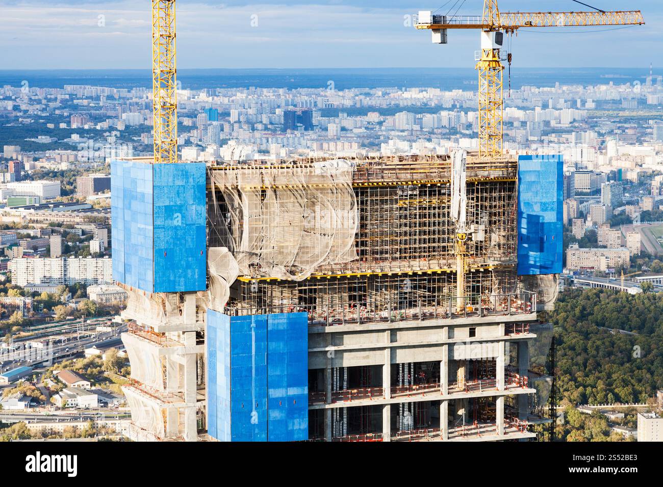 scaffolding of skyscraper under construction in Moscow city in autumn ...