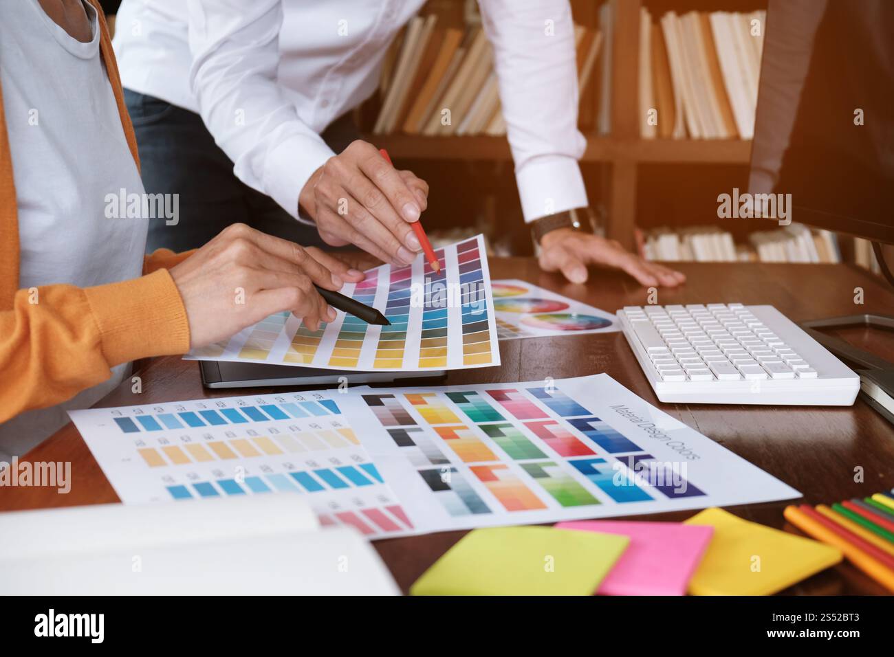 Graphic designer working on digital tablet. artist drawing on graphic tablet and Color swatch ...