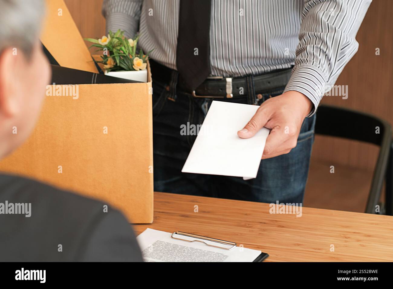 Business man sending resignation letter to boss and Holding Stuff ...