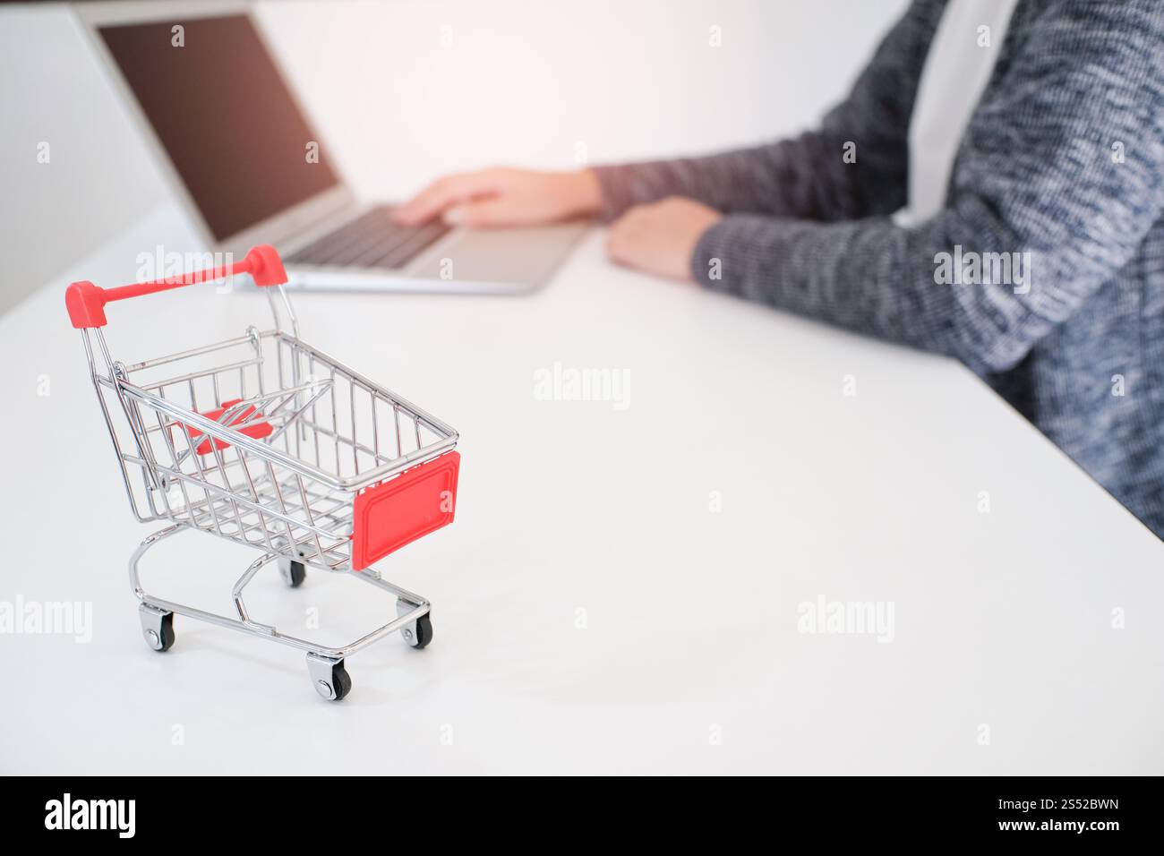 Woman and Small shopping cart with Laptop for Internet online shopping ...