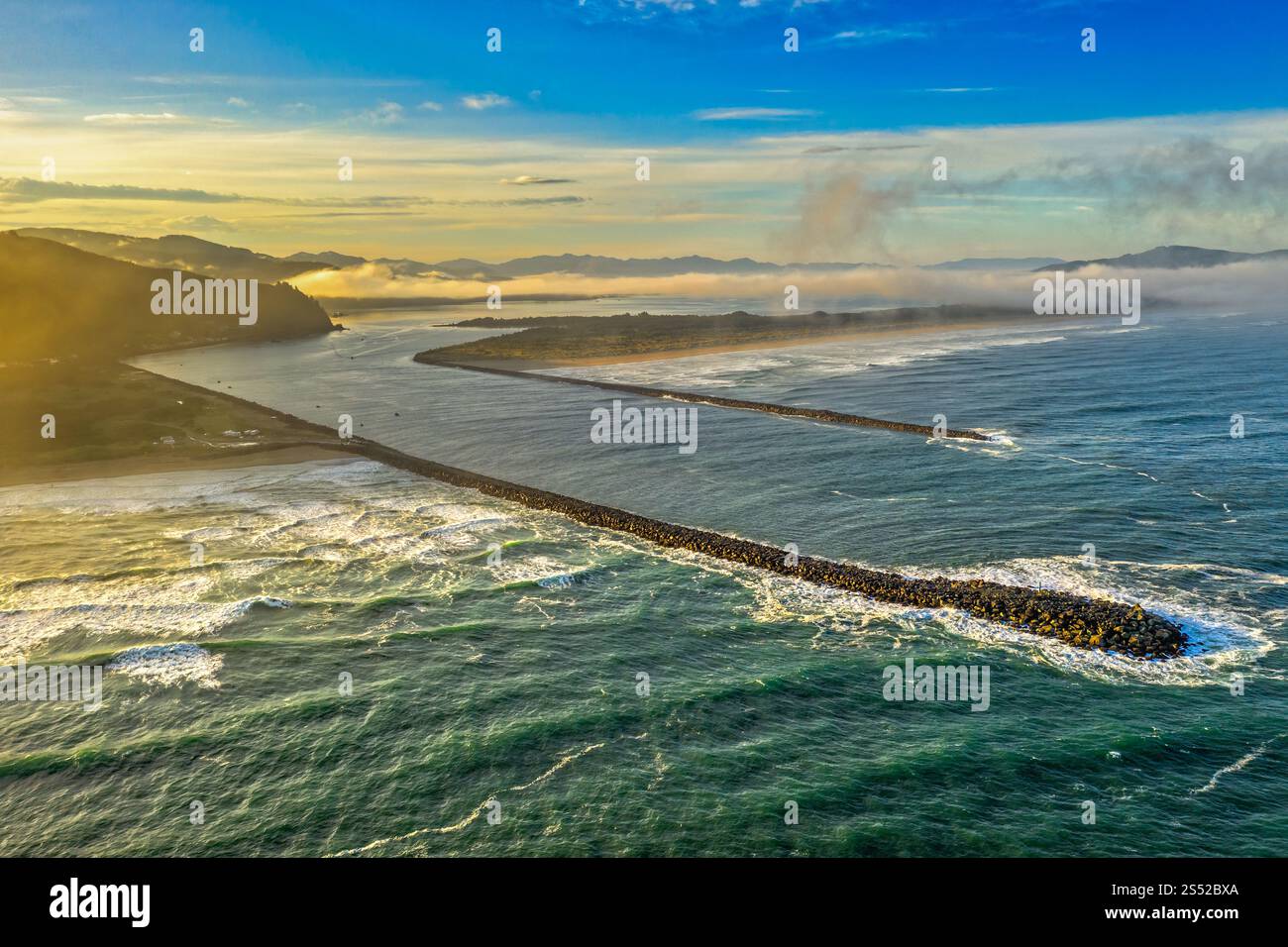 Sunrise over the Barview Jetty, the entrance to the Port of Garibaldi ...