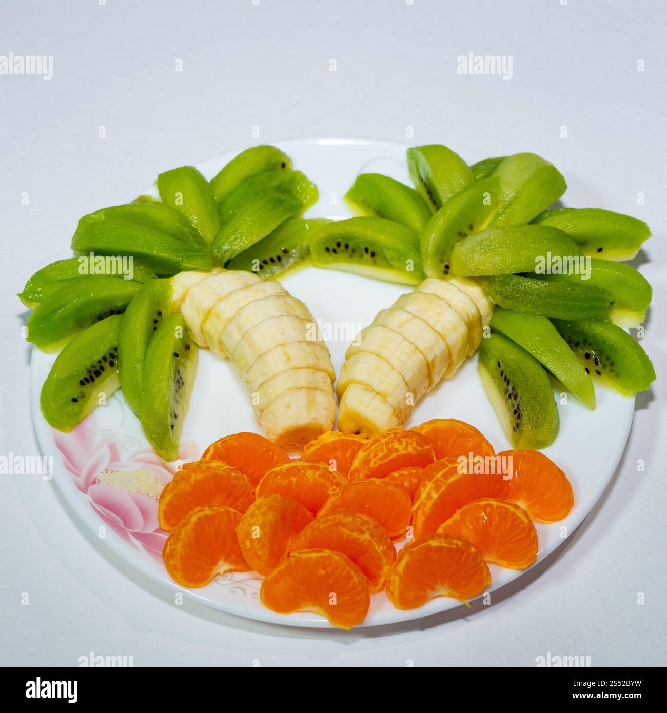 A delightful combination of sliced bananas and kiwis arranged to ...