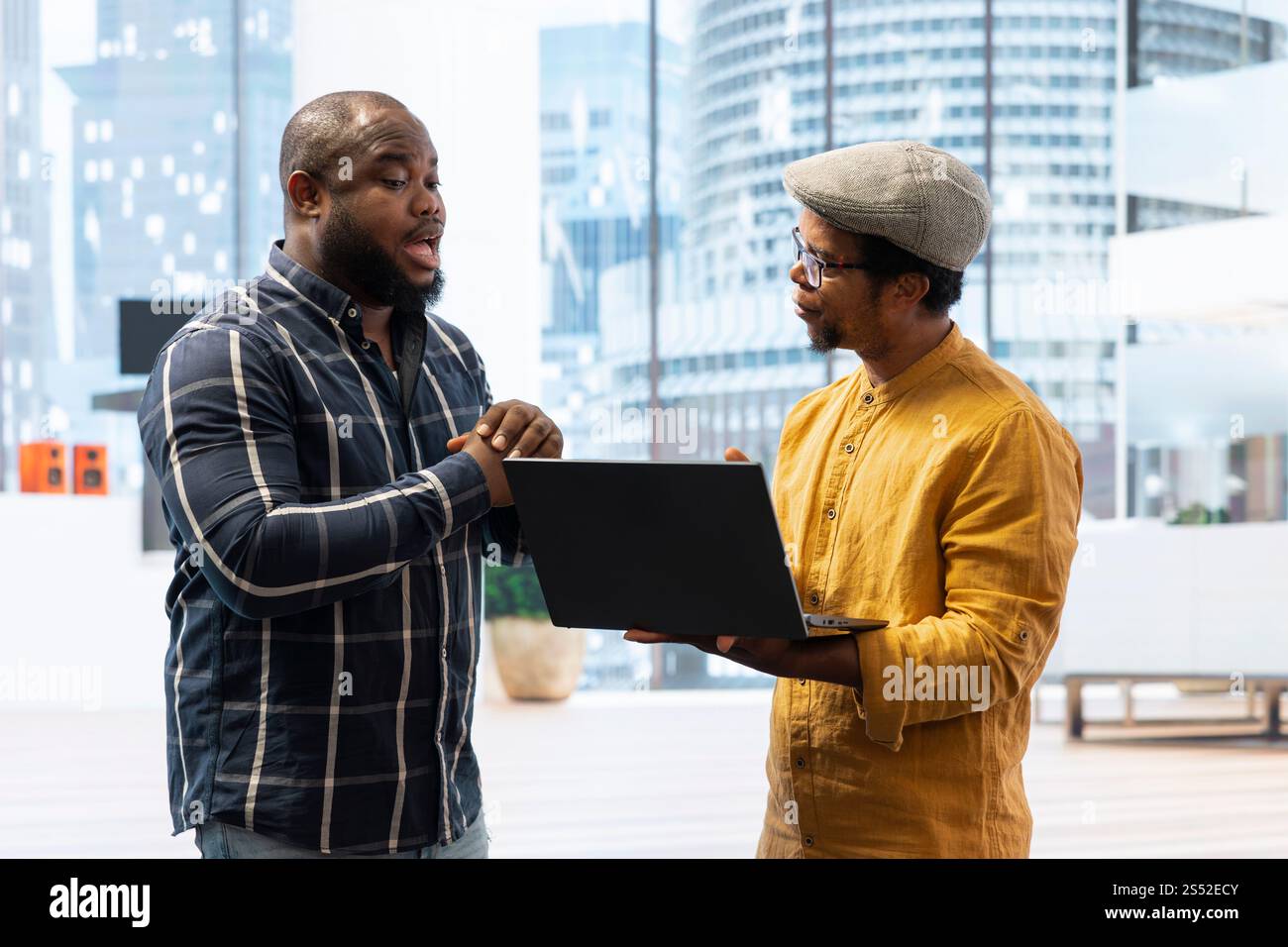 Entrepreneur meeting with a real estate broker on an office tour ...